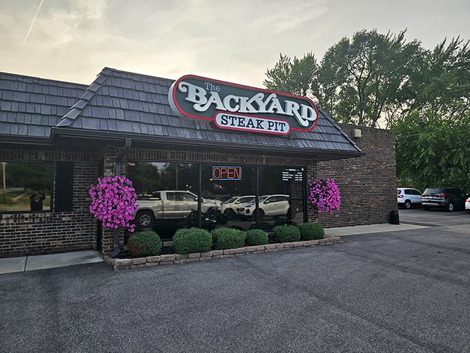 Summer brings hanging flower baskets that frame The Backyard Steak Pit's entrance. Even the building looks dressed for dinner!