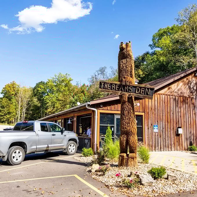A carved wooden bear guards the entrance like a furry ma&icirc;tre d', silently promising steaks worth growling about.