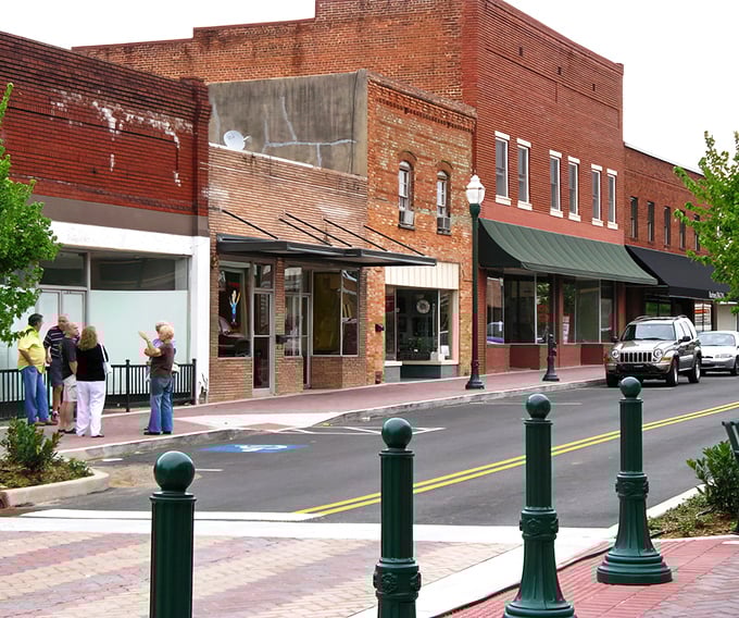 These charming green lampposts aren't just decorative&mdash;they're holding up decades of small-town conversations and friendly hellos.