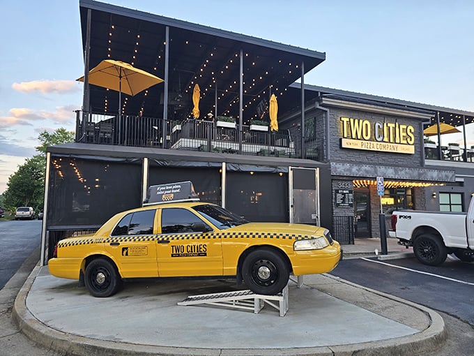 That yellow taxi isn't lost &ndash; it's announcing "New York style inside!" while the rooftop patio whispers "stay awhile" under twinkling lights.