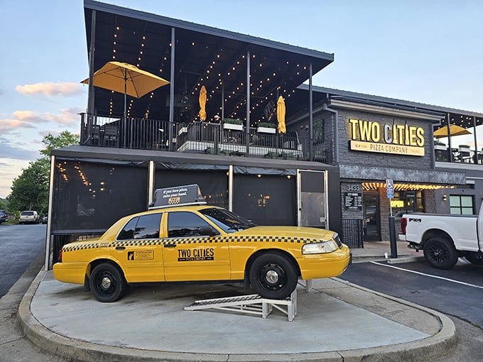 That yellow taxi isn't lost&mdash;it's Two Cities' cheeky nod to their New York-Chicago pizza rivalry. The rooftop dining awaits!