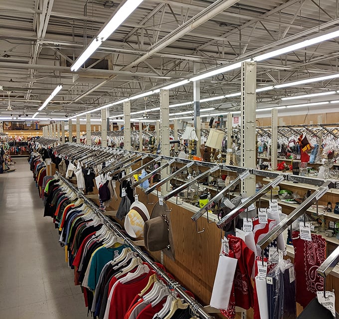 Valley Thrift interior: Rows upon rows of perfectly organized clothing await, like a fashionista's dream where everything's priced like it's 1995.