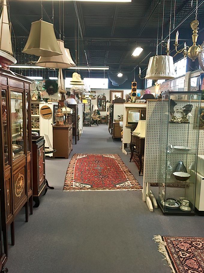 Lampshades hang like curious jellyfish above a sea of antiques. That Persian rug isn't just decoration&mdash;it's a time machine to another era.