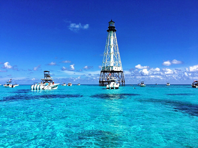 The turquoise gradient around Alligator Reef Lighthouse isn't Photoshop — it's Mother Nature showing off her best work in the Florida Keys.