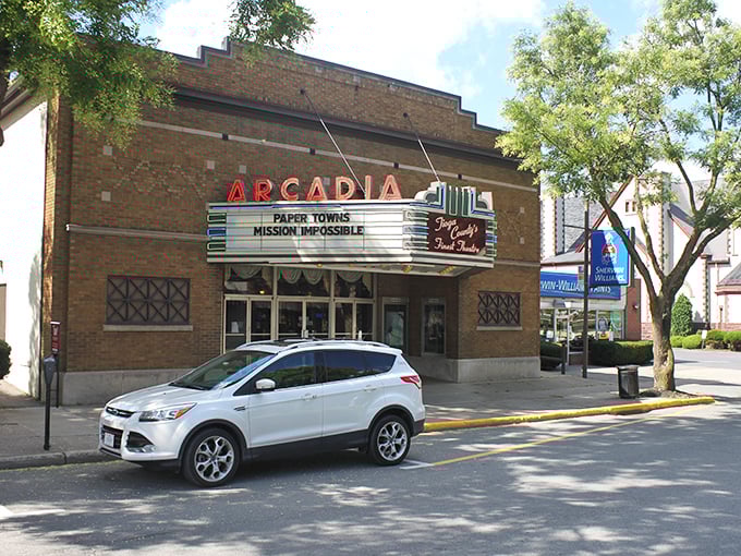 The Arcadia Theatre's vintage marquee lights up downtown evenings, proving that movie magic feels more special without twenty-seven viewing options.