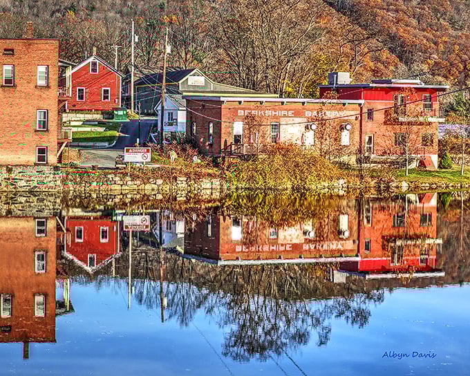Brick buildings with character to spare, their autumn reflections dancing in the Deerfield River like nature's watercolor.