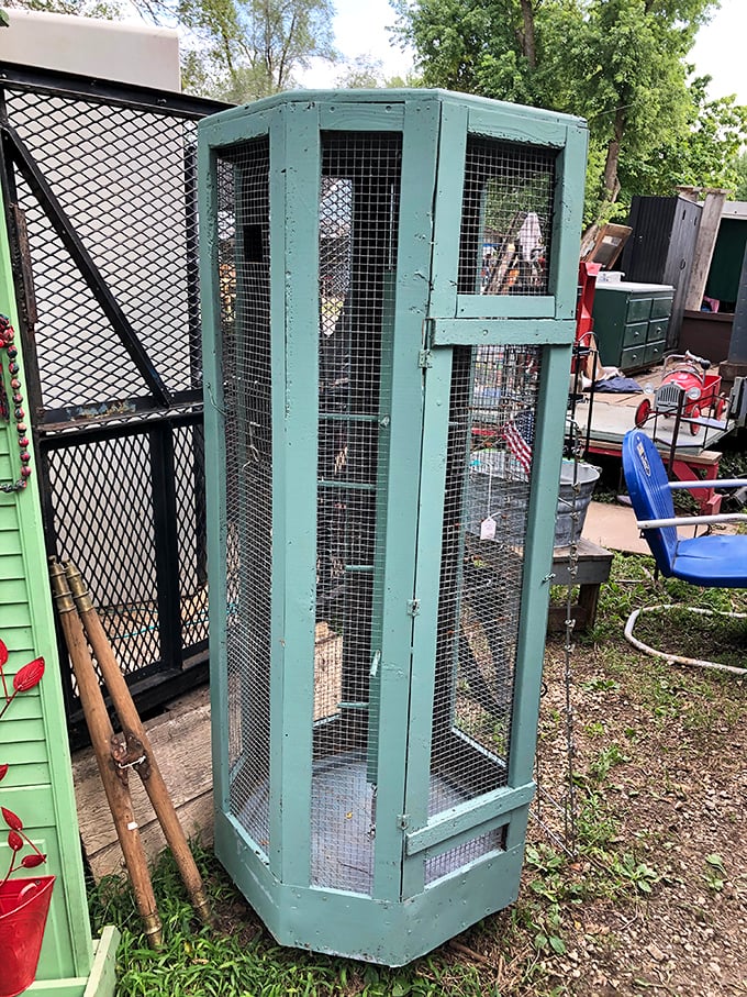 This mint-green vintage bird cage isn't just storage&mdash;it's a conversation piece waiting to happen. Someone's grandmother definitely had one of these in her sunroom.