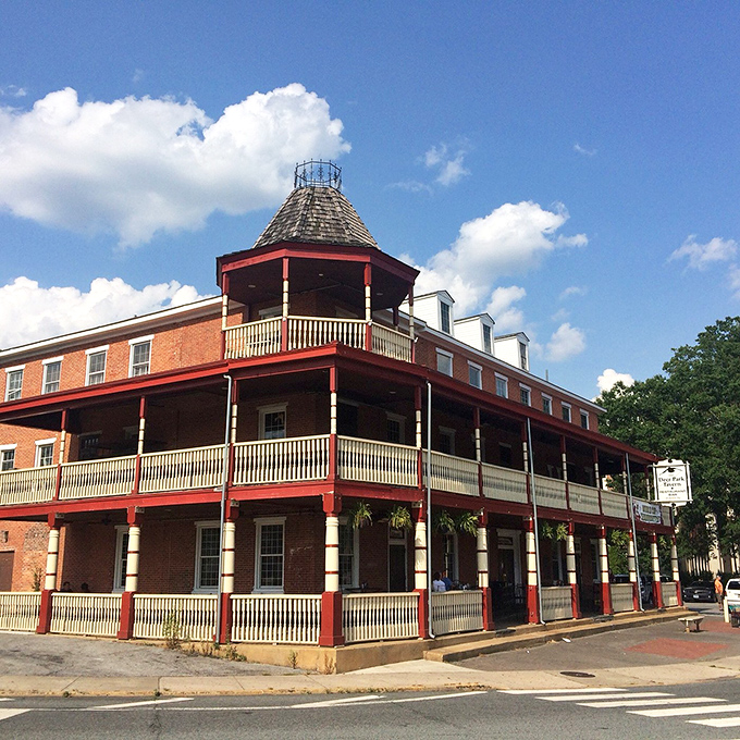 The historic Deer Park Tavern stands as Newark's crown jewel, its wraparound porches practically begging you to sit a spell and watch the world amble by.