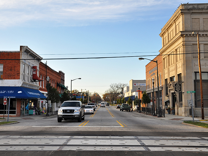 Historic brick facades line Benson's welcoming Main Street, where local businesses have turned shopping into a genuinely social experience rather than a chore.