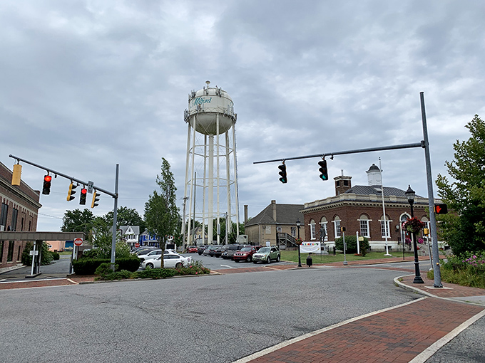 Milford's iconic water tower stands sentinel over lush greenery, like a lighthouse for landlubbers guiding you to downtown's treasures.