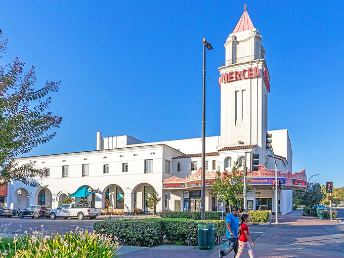 Merced's iconic theater tower reaches skyward like an art deco exclamation point, announcing "affordable living here!" to all who pass by.