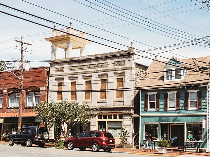 Historic buildings stand shoulder to shoulder along High Street, their brick facades telling stories that stretch back to colonial times.