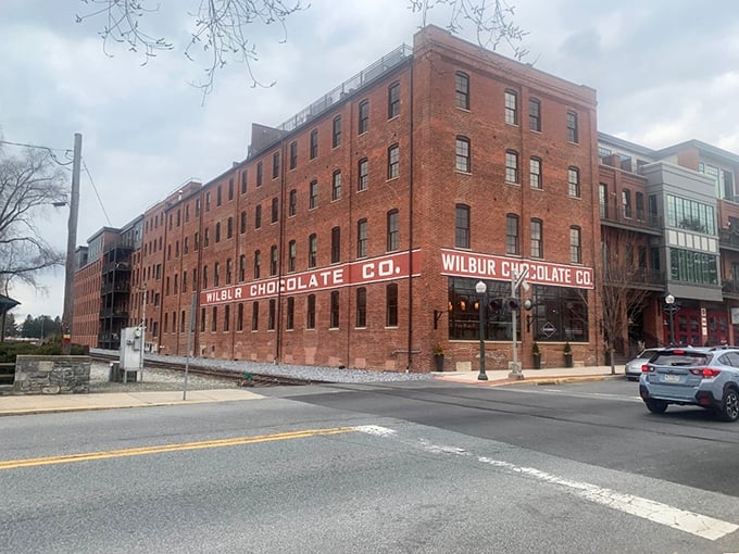 The imposing Wilbur Chocolate factory building dominates the streetscape, a brick cathedral to cocoa that's been tempting sweet tooths for generations.