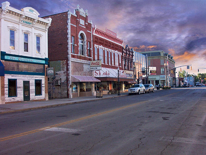 Twilight transforms downtown Delphos into a Norman Rockwell painting come to life, with century-old buildings bathed in the warm glow of a Midwestern sunset.