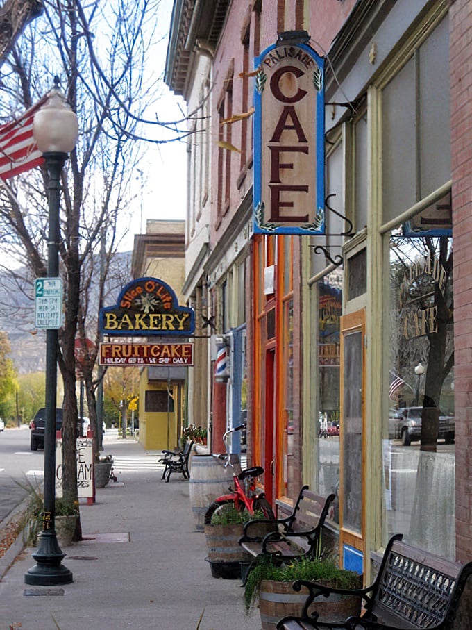 Downtown's colorful storefronts house treasures like Palisade Cafe and Slice O' Life Bakery, where locals gather and visitors become regulars.