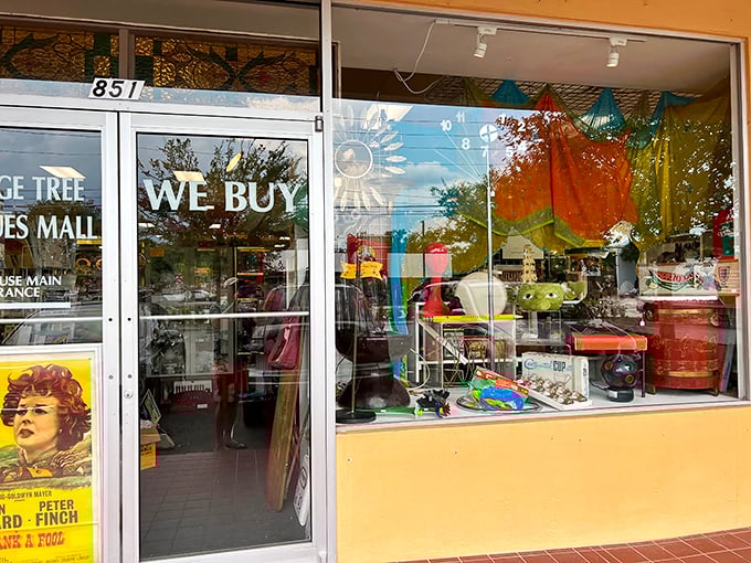 "We Buy" indeed! The storefront beckons with colorful promises and a window display that's like a time-traveling Instagram feed from decades past.