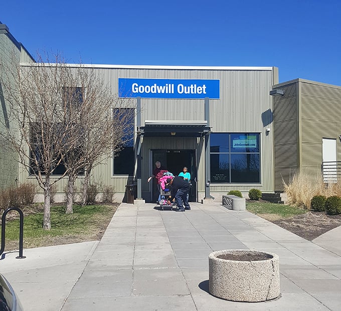 Thrift pilgrims gather at the gates of possibility, shopping carts at the ready for the $25 adventure that awaits inside.