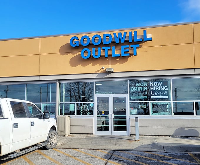 The bright blue Goodwill Outlet sign serves as a beacon for bargain hunters&mdash;a modern-day "X marks the spot" for thrift adventurers ready to dig.