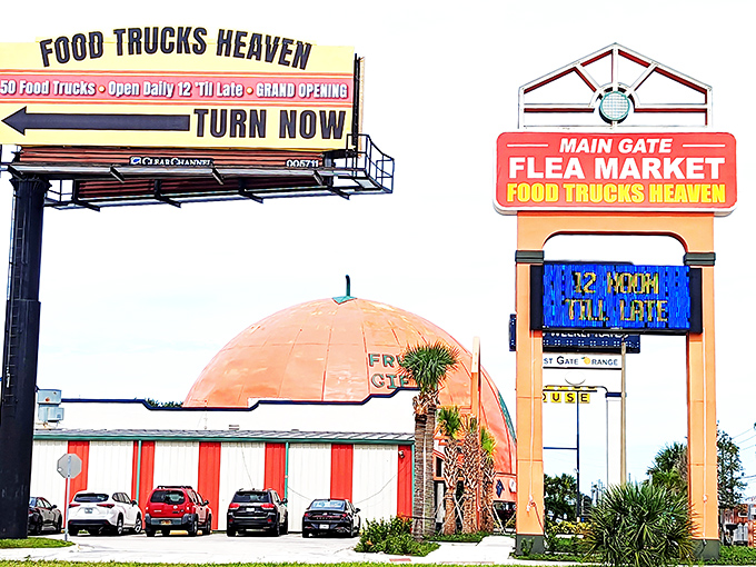 The unmistakable orange dome of Main Gate Flea Market stands like a retail lighthouse, beckoning bargain hunters to "Food Trucks Heaven."
