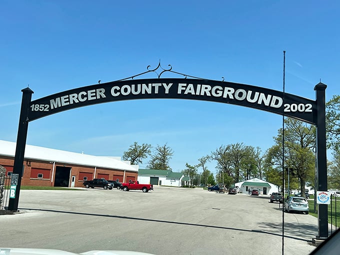The Mercer County Fairgrounds entrance: where agricultural tradition meets cryptozoological wonder. Your GPS won't warn you about the Bigfoot ahead.
