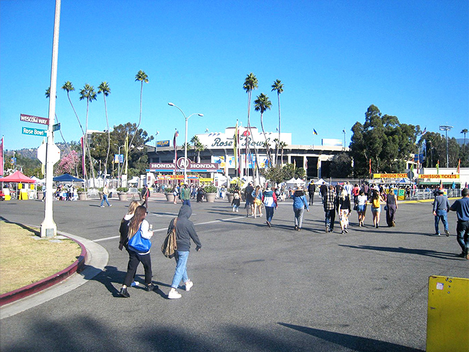 The pilgrimage begins! Early birds stream toward the stadium under classic California skies, each hoping to uncover that perfect something they didn't know they needed.