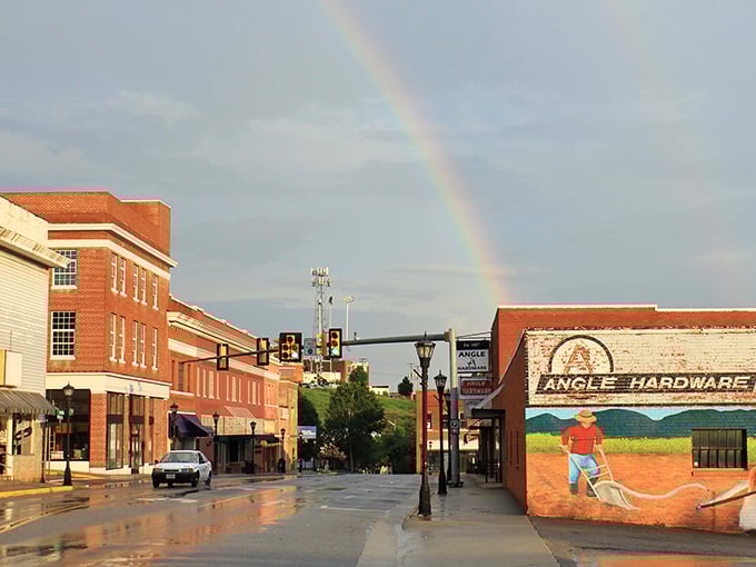Angle Hardware's vintage mural tells a story of agricultural heritage while rainbows paint the sky above Franklin Street.