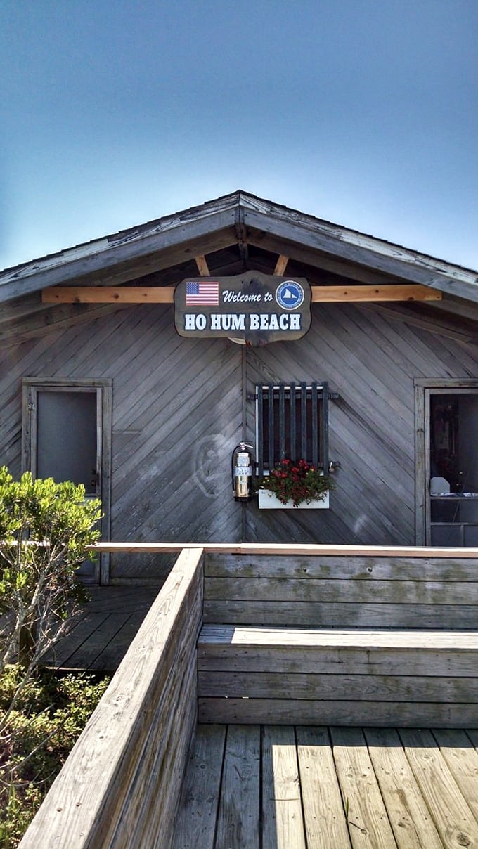 Ho-Hum Beach's weathered wooden pavilion stands as a testament to simple pleasures – no frills, just the promise of sand, sea, and serenity.