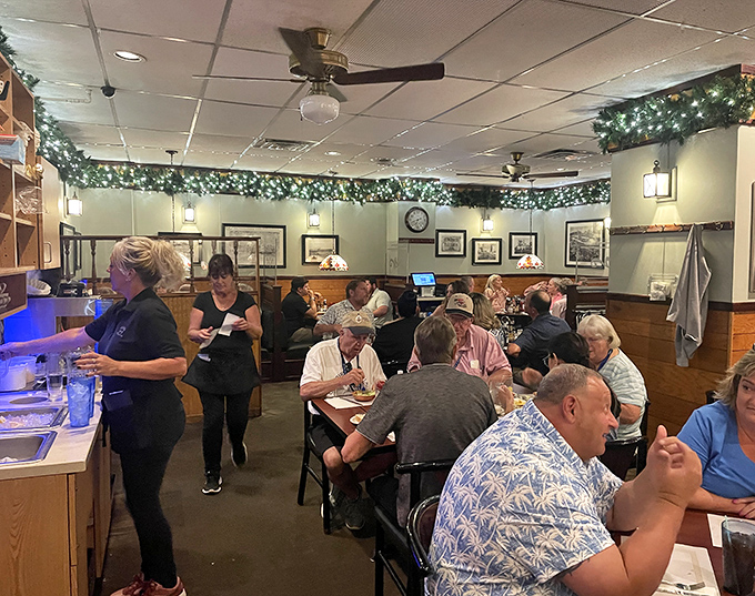 Inside, holiday greenery meets wood paneling in a dining room where conversations flow as freely as the sweet tea. No Instagram filters needed&mdash;this is authentic Ohio comfort.
