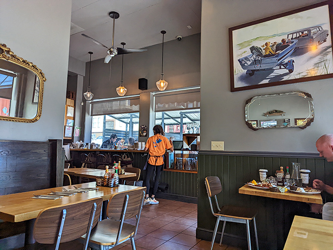 Inside, the unpretentious charm of wooden wainscoting and pendant lighting creates the perfect backdrop for breakfast masterpieces to take center stage.