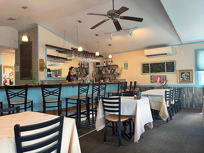 Inside, coastal blues and crisp whites create the perfect backdrop for culinary drama. Like your favorite aunt's beach house, if your aunt were a gourmet chef.