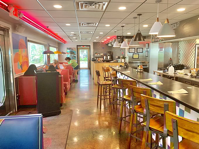 Step inside and the years melt away&mdash;red neon lighting, wooden barstools, and that unmistakable diner energy that says "stay awhile, the coffee's always hot."