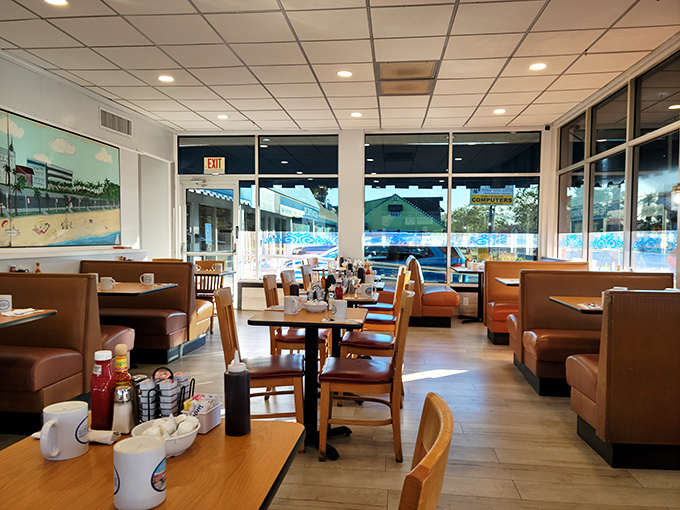 Cozy booths, wooden tables, and large windows create that perfect "everybody knows your name" vibe where breakfast dreams come true.