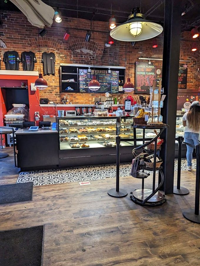 Exposed brick walls and gleaming display cases create the perfect backdrop for life-changing dessert decisions. The hardest part? Choosing just one slice.
