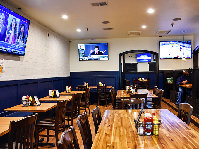 The cozy interior strikes that perfect balance between sports bar energy and comfortable dining room, where wooden tables invite you to settle in for the evening.