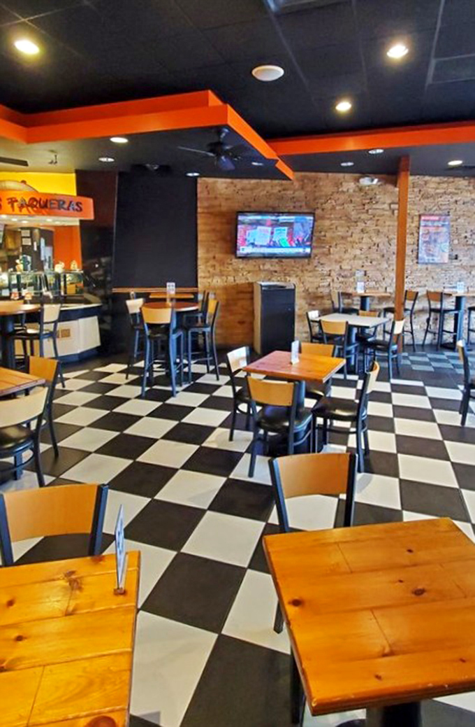 The checkered floor and warm wooden tables create that perfect "I've discovered something special" atmosphere that makes you want to text friends immediately.