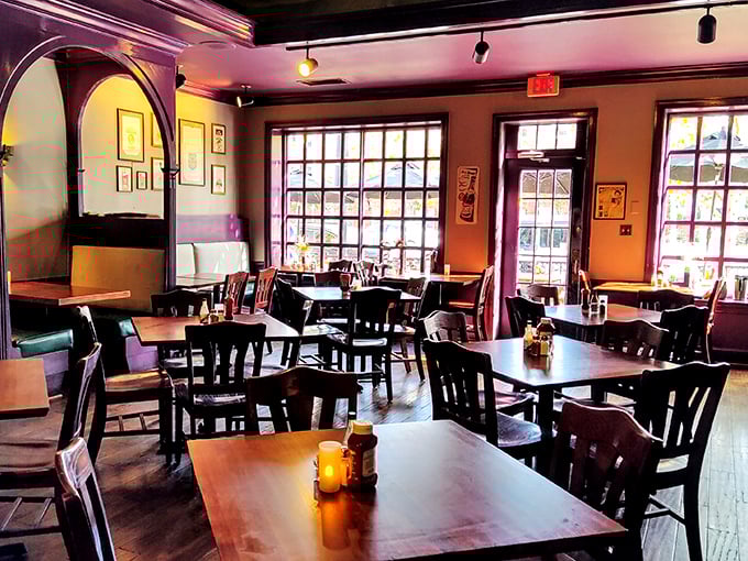 Warm wood tones and purple-trimmed windows create that rare atmosphere where you feel instantly at home, yet still on a delicious adventure.