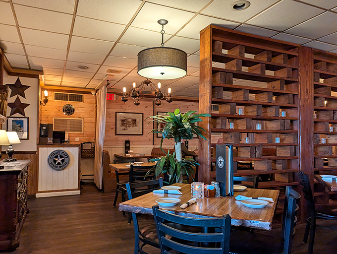 Rustic wooden dividers and warm lighting create dining spaces that feel both spacious and intimate. The kind of place where conversations flow as smoothly as the drinks.