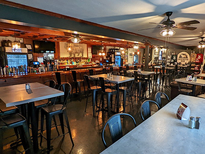 Inside, the warm wood tones and industrial-chic metal chairs create the perfect backdrop for the serious business of barbecue appreciation.