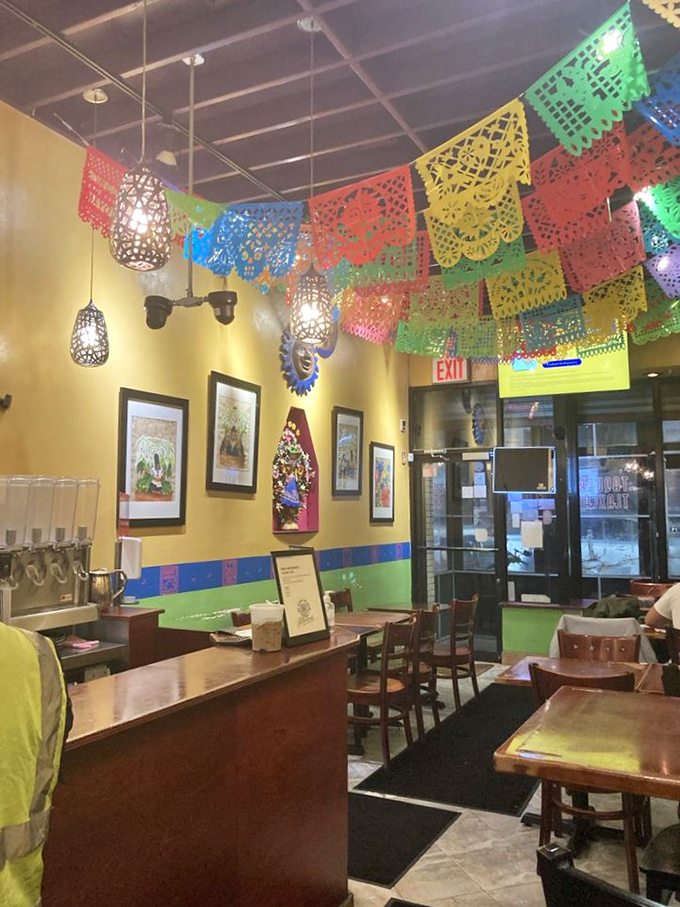 Step inside and the fiesta begins! Colorful papel picado banners dance overhead while traditional artwork transforms this Bronx gem into a slice of Mexico.