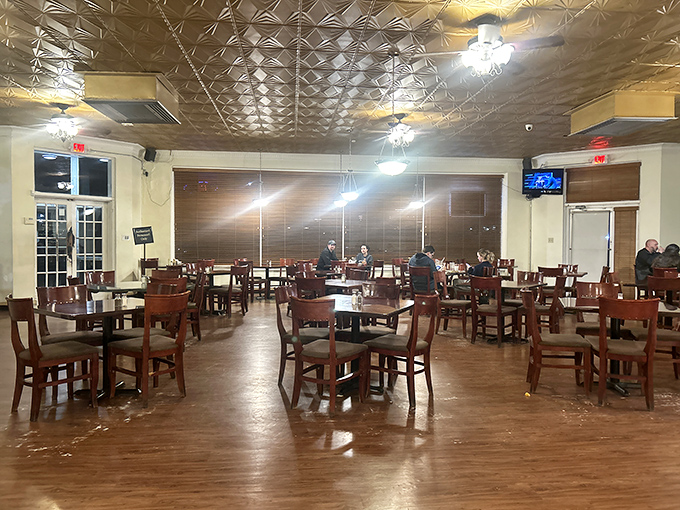 Pressed tin ceilings and wooden furnishings create an atmosphere that's both comfortable and timeless. This dining room has witnessed countless celebrations and everyday joys.