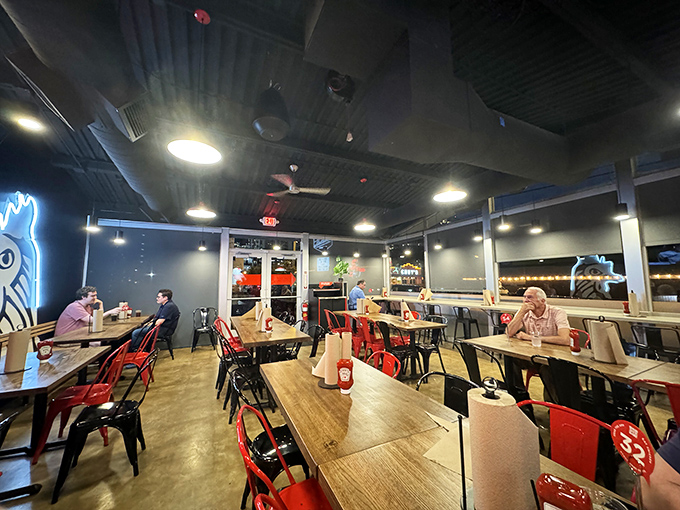 Industrial-chic meets Southern hospitality in this no-nonsense dining room. Red metal chairs stand ready for the brave souls about to test their heat tolerance.