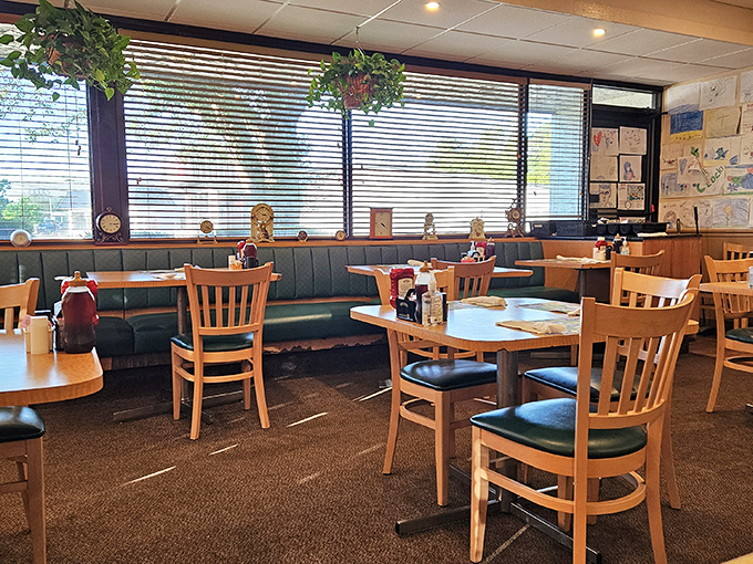 Classic diner comfort with teal vinyl booths and wooden chairs &ndash; where conversations flow as freely as the coffee. Children's artwork on the walls tells you families have been coming here for generations.