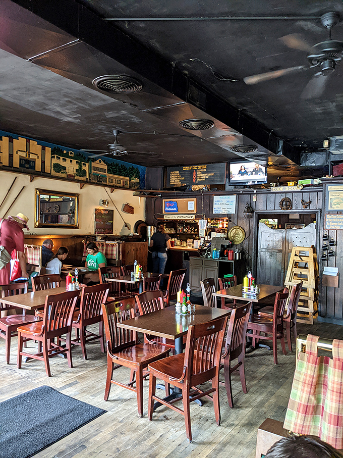 Inside Zip's, worn wooden floors and vintage decor create that rare atmosphere where conversations flow as easily as the beer.