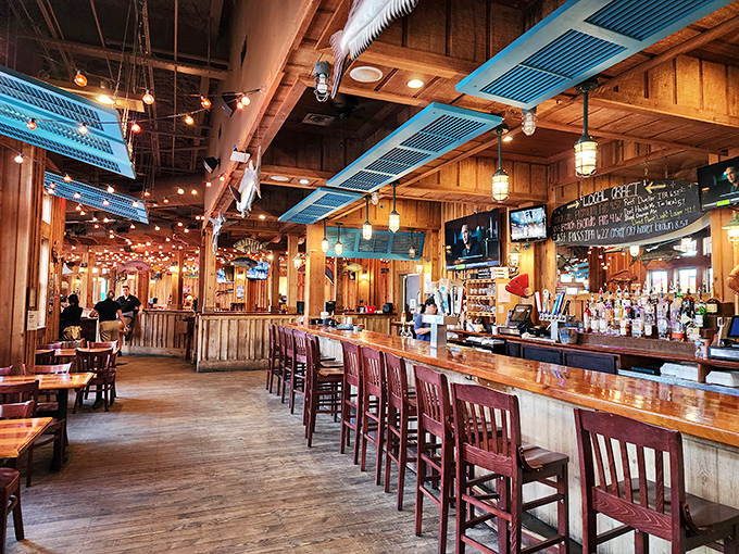 2. interiorWooden walls, string lights, and nautical charm create the perfect beach cabin vibe. It's like someone built a restaurant around your favorite vacation memory.