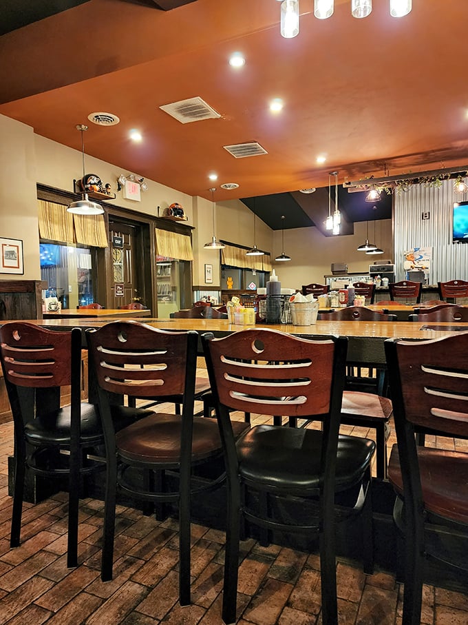 Pull up a chair with those charming moon-shaped cutouts and settle in beneath the warm amber glow of a ceiling that promises comfort food paradise.