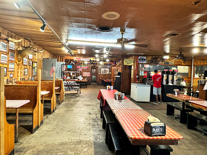 Inside Black's, time stands still. The checkered tablecloths and wood-paneled walls have witnessed more barbecue epiphanies than a smoke-scented confessional.