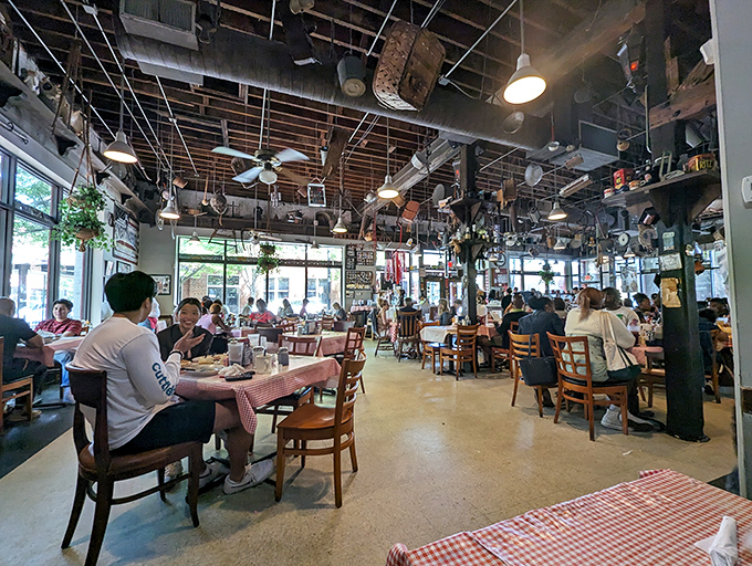 Antique farm tools dangle from the ceiling like a museum of rural Americana where breakfast is the main exhibit. Southern history you can eat under.