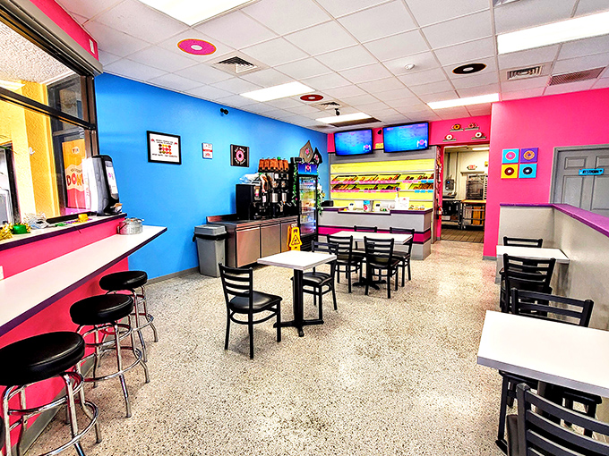Step inside and the vibrant blue and pink walls hit you like a sugar rush before you've taken your first bite. This isn't just a donut shop; it's a mood enhancer.