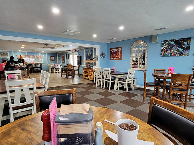 Inside, the blue walls and checkerboard floor create a casual vibe that says, "Relax, you're about to experience seafood that doesn't need fancy surroundings to impress."
