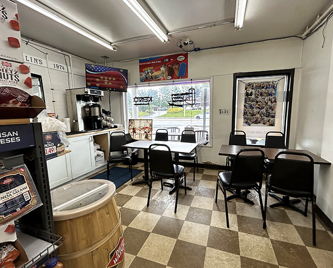 Inside, the classic checkerboard floor and no-nonsense seating tell you everything – this place prioritizes sandwich perfection over interior design awards.